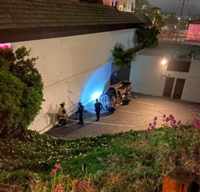 Drunk driver flips car over a fence, off a 10-foot ledge and into ...